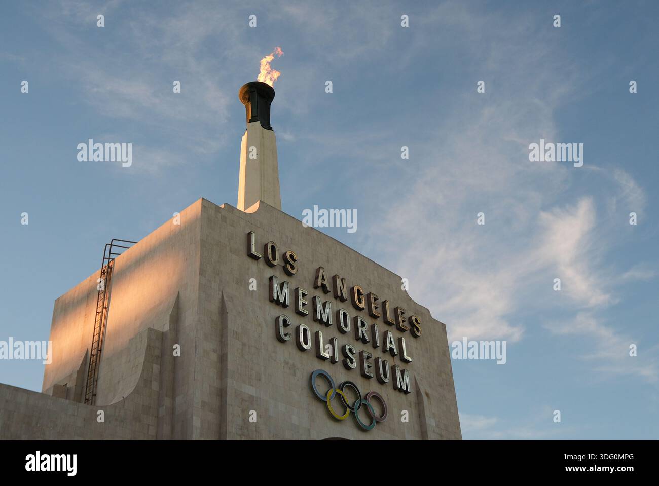 The Olympic cauldron is lit at the Los Angeles Memorial Coliseum ahead ...