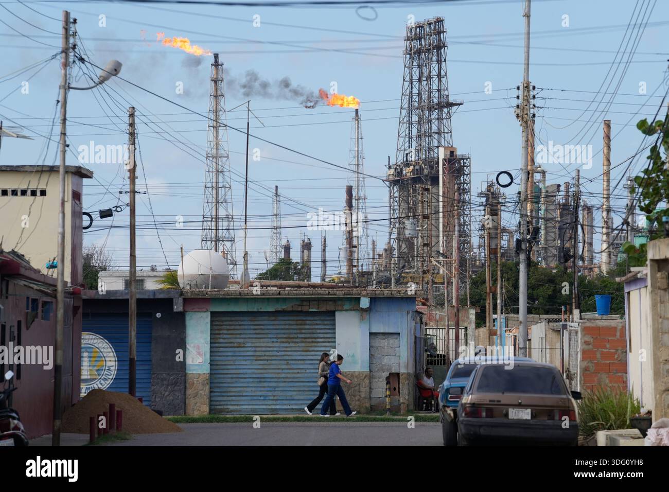 Flames rise from flare stacks at the Amuay refinery in Los Taques ...