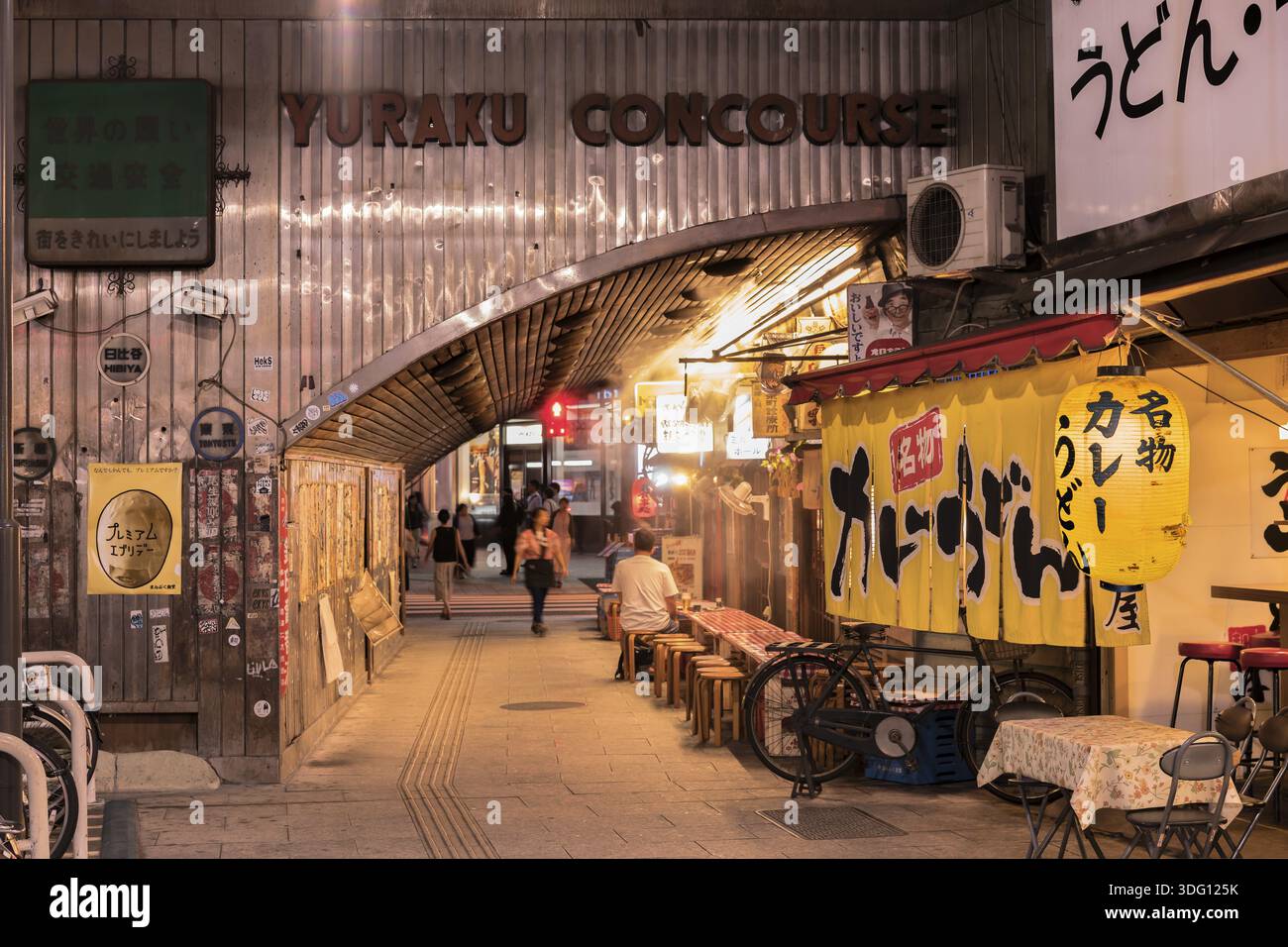 Night view of Yurakucho Concourse underpass under the railway line of ...