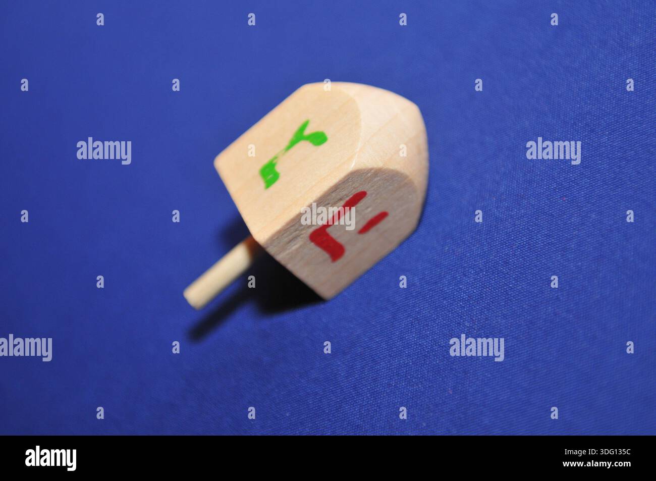 Traditional wooden dreidel used in Jewish Hanukkah celebrations ...