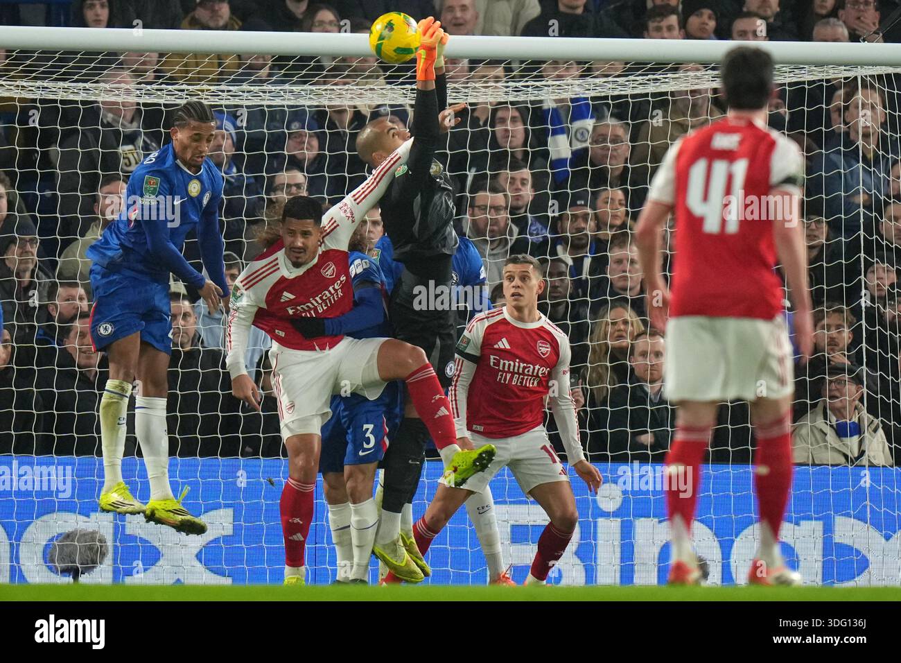 Chelsea's goalkeeper Robert Sanchez, center, tries to catch the ball ...