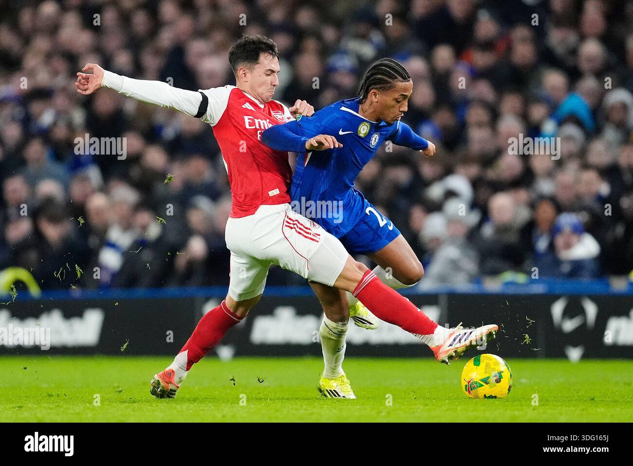 Arsenal's Martin Zubimendi (left) and Chelsea's Joao Pedro battle for ...