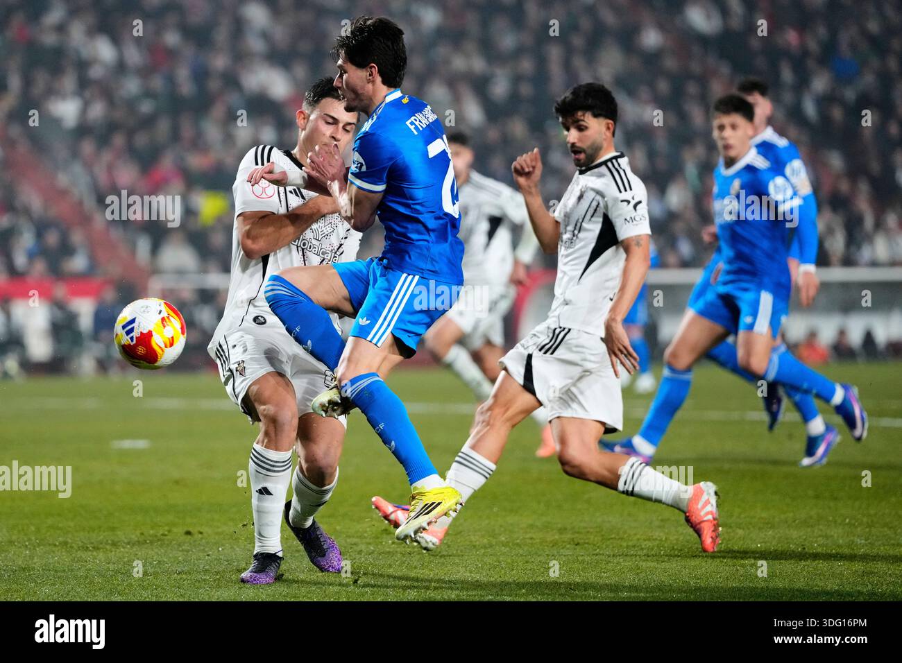 Real Madrid's Fran Garcia, second left, duels for the balls with ...