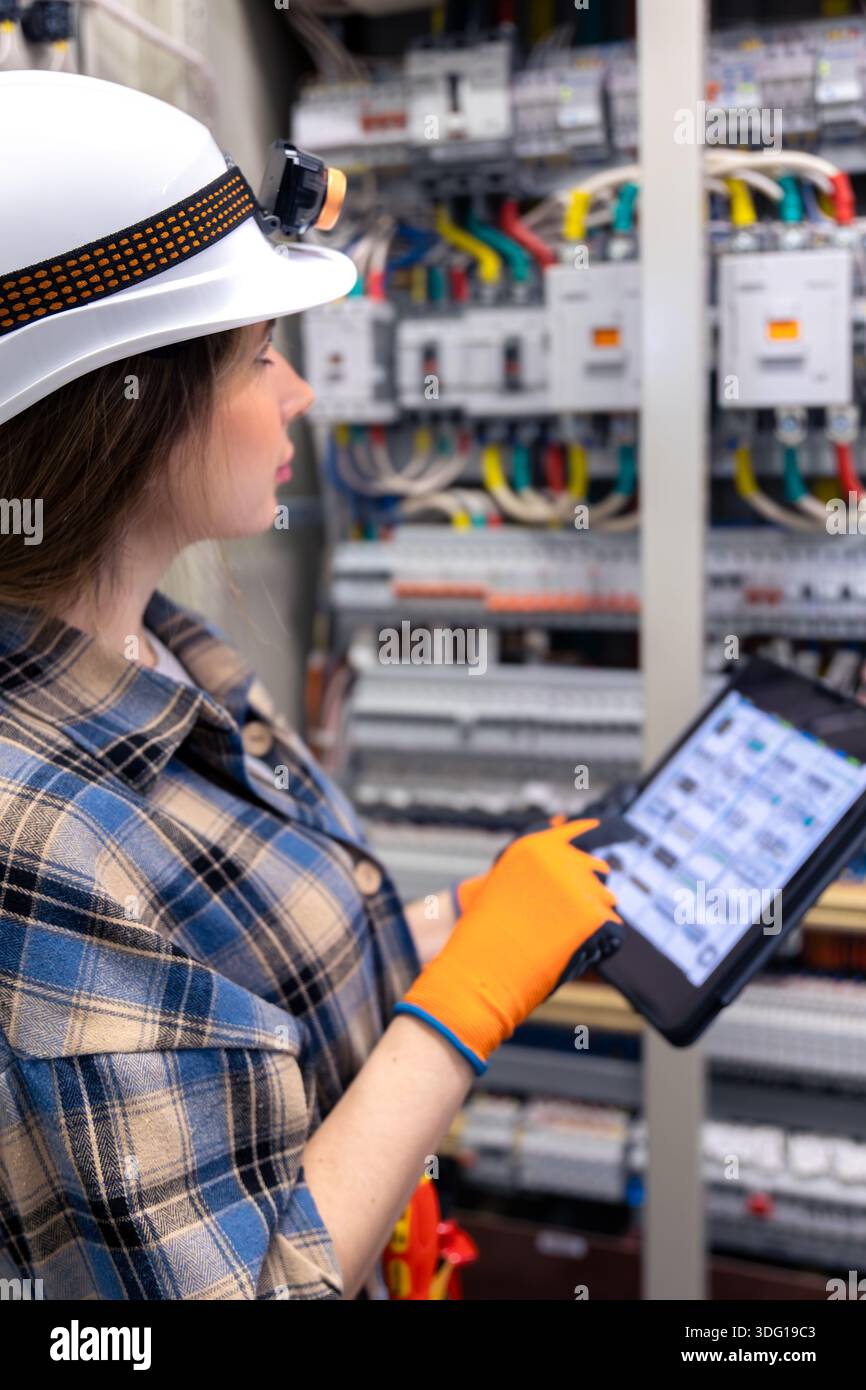 Switchboard check electrician tablet hi-res stock photography and ...