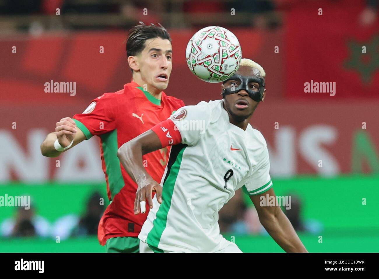 Morocco's Nayef Aguerd , left, and Nigeria's Victor Osimhen fight for ...
