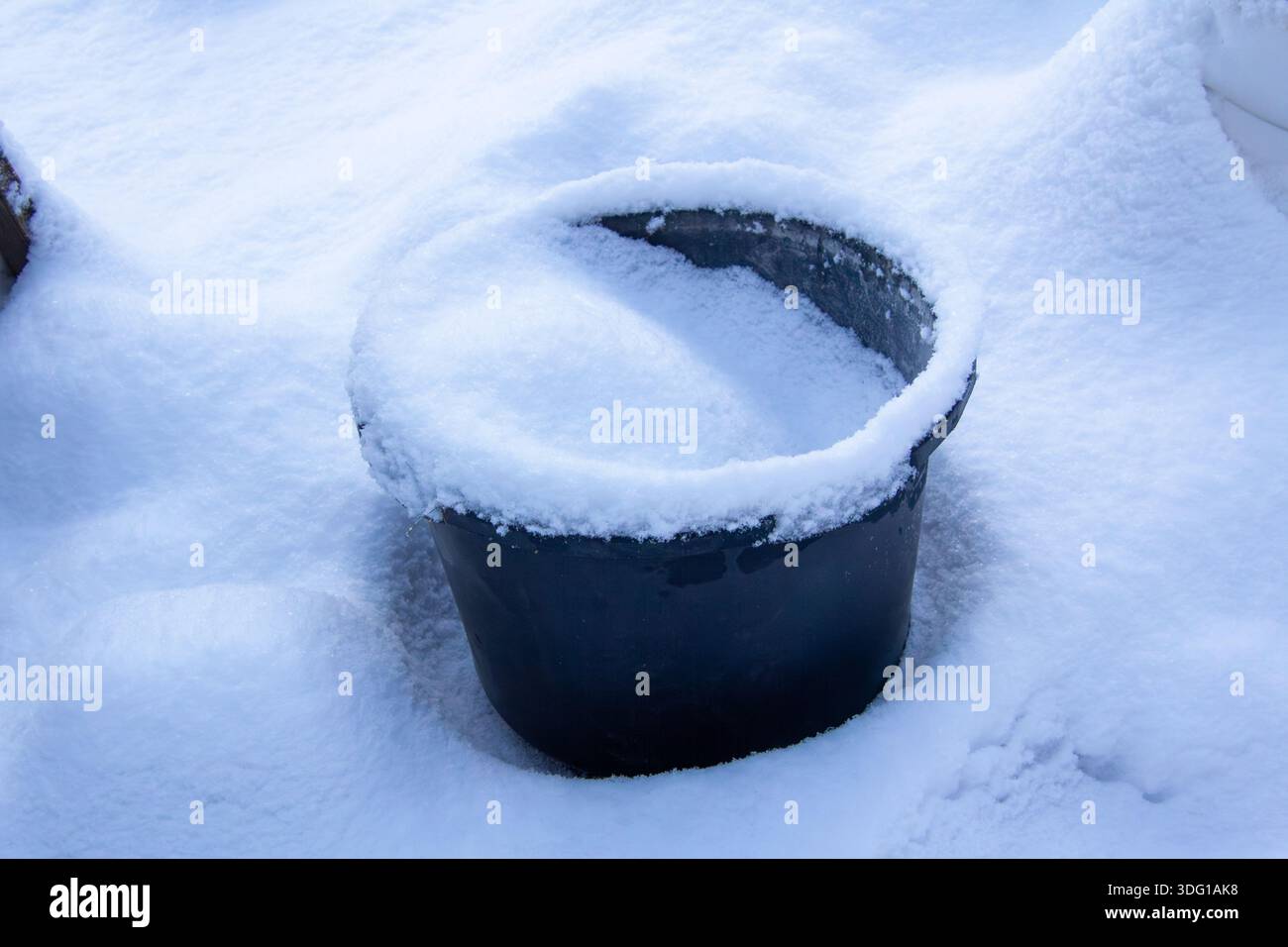 Large bucket filled with snow Stock Photo - Alamy