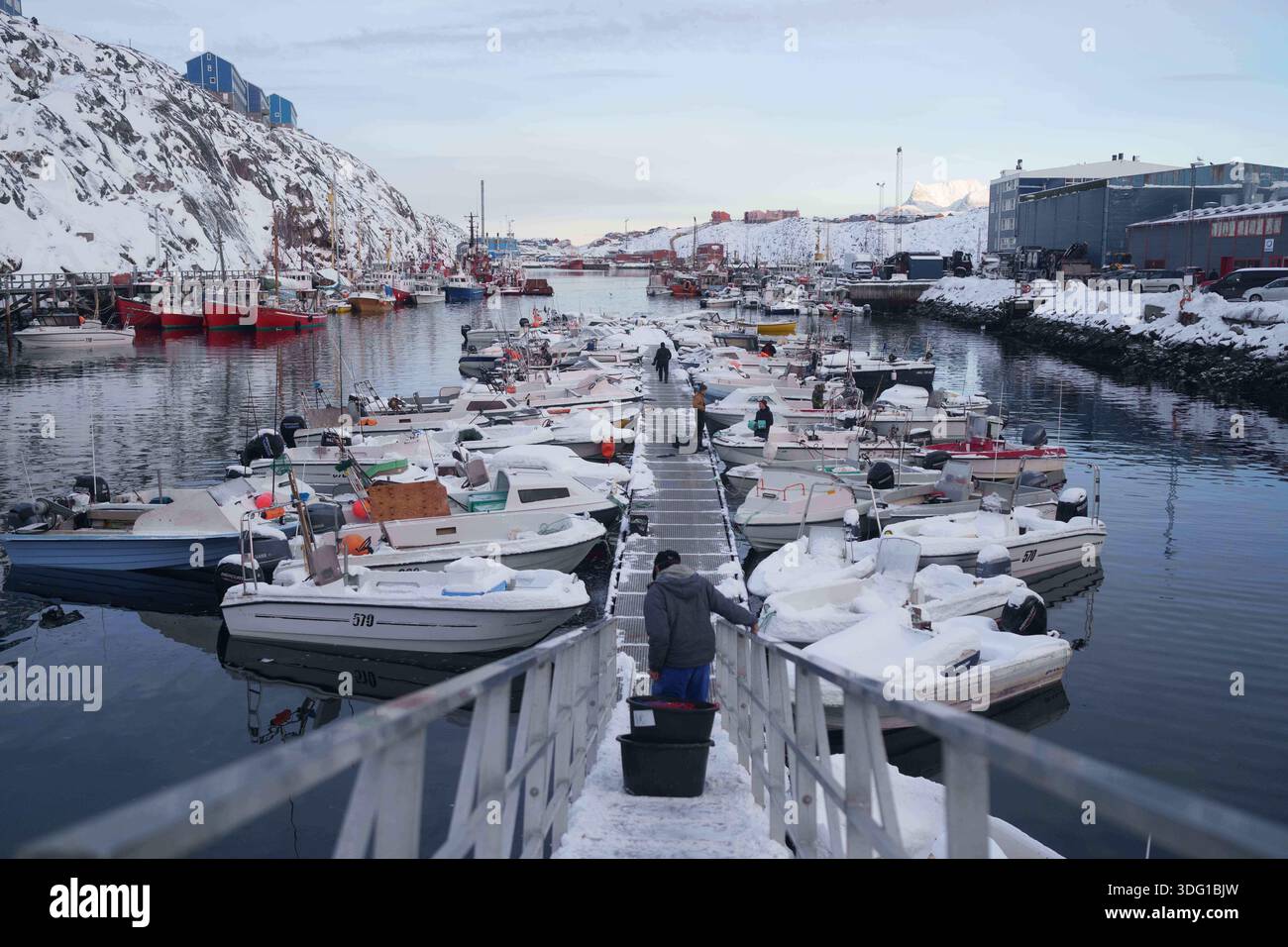 Fishermen arrive at the harbour of Nuuk, Greenland, Wednesday, Jan. 14 ...