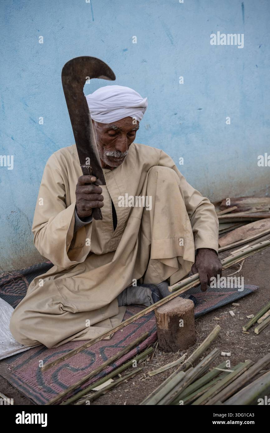 An Egyptian craftsman makes furniture from palm fronds. Natural palm ...