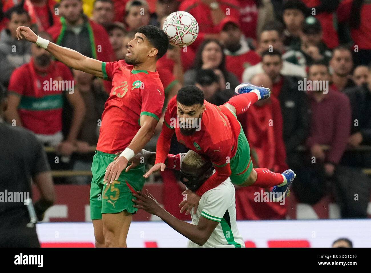Morocco's Bilal El Khannouss, left, and Noussair Mazraoui jump over ...