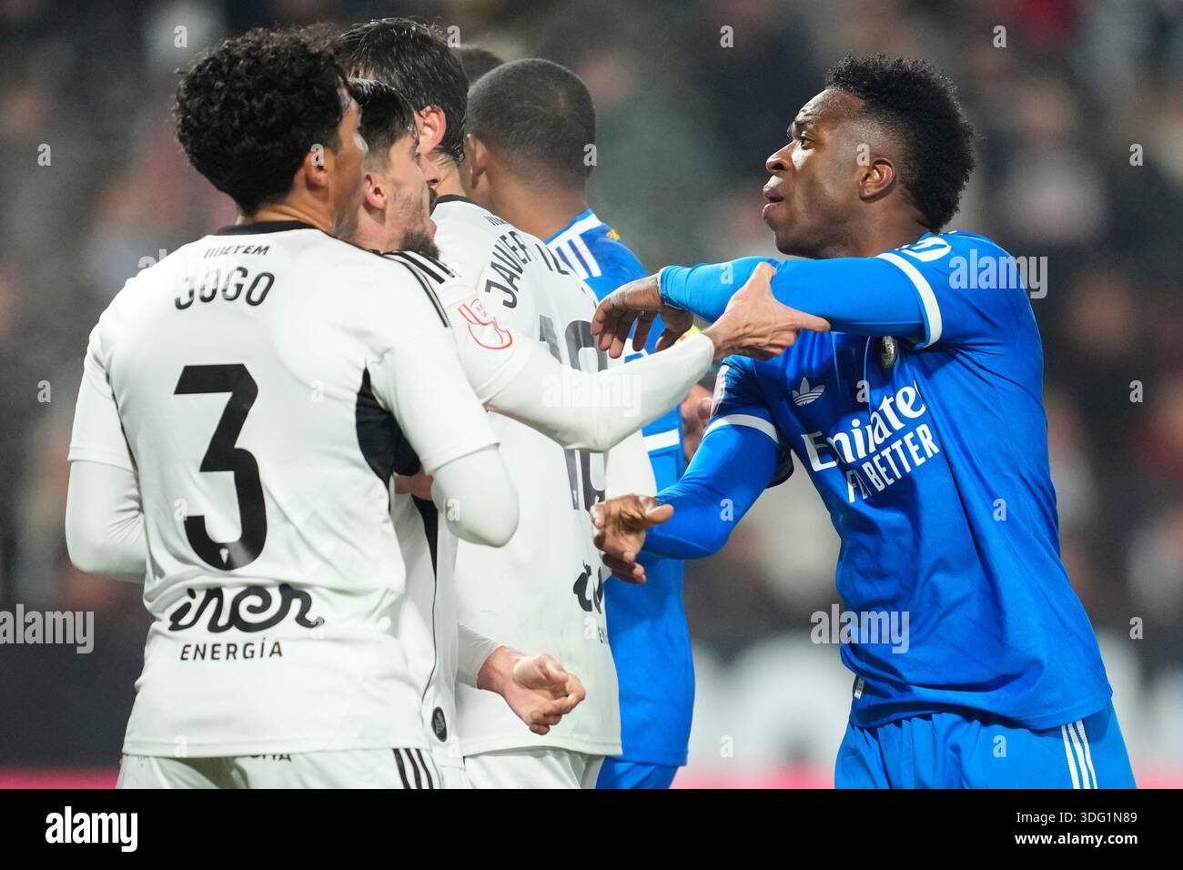 Real Madrid's Vinicius Junior argues with Albacete's players during the ...