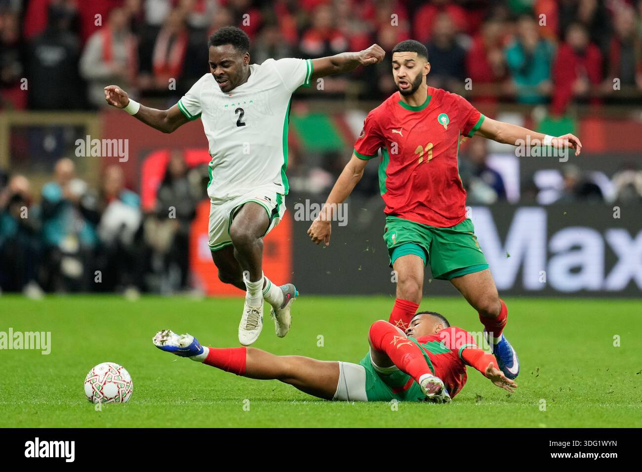 Nigeria's Bright Osayi-Samuel escapes thne tackle by Morocco's Hamza ...