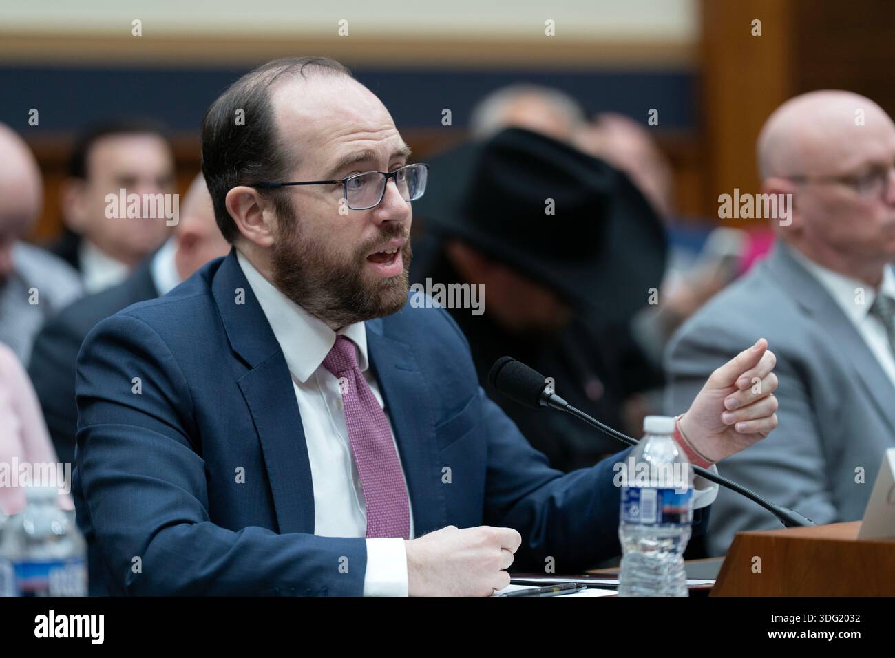Former DOJ prosecutor Michael Romano testifies before the House Select ...