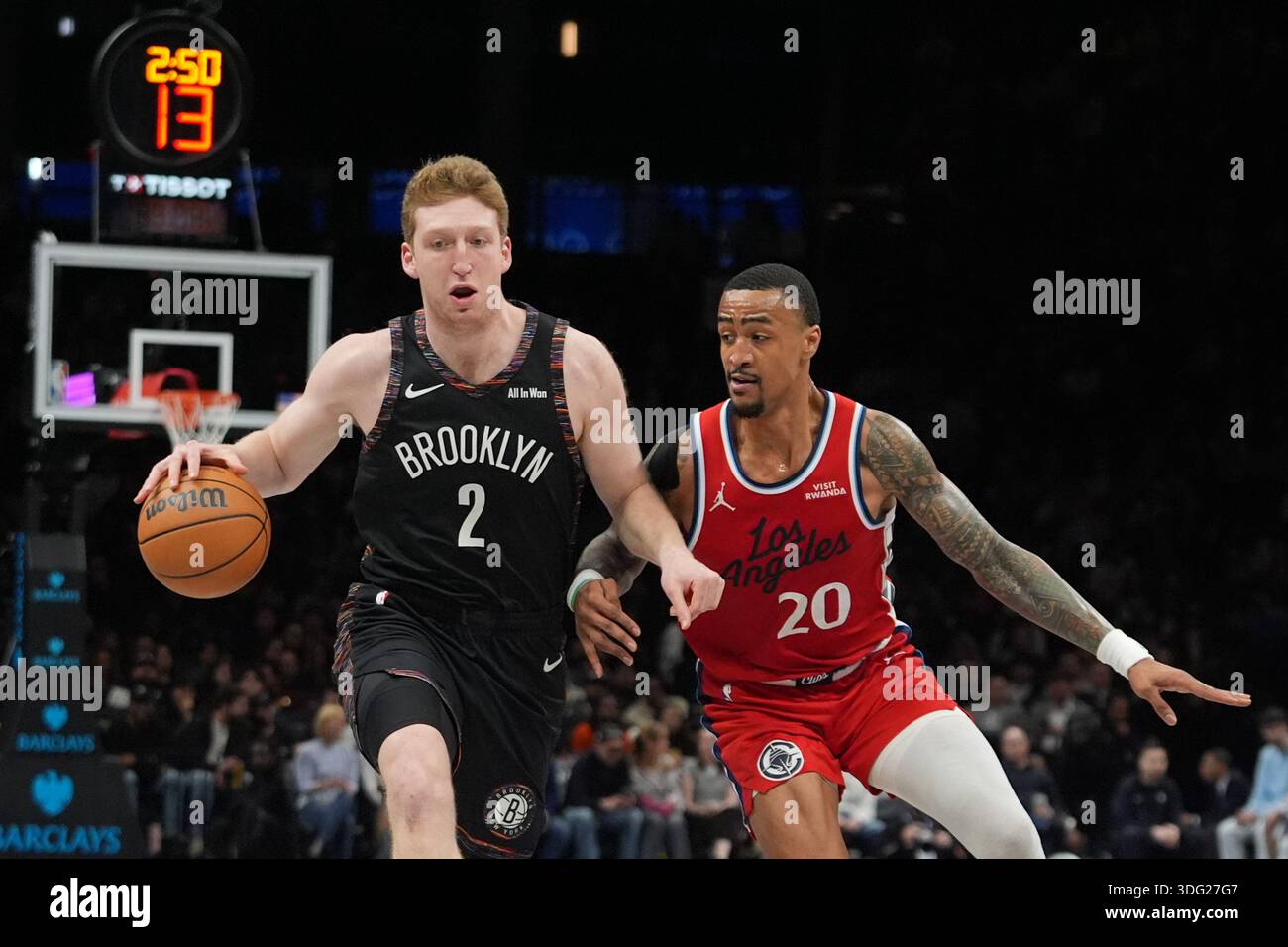 LA Clippers' John Collins (20) defends Brooklyn Nets' Danny Wolf (2 ...