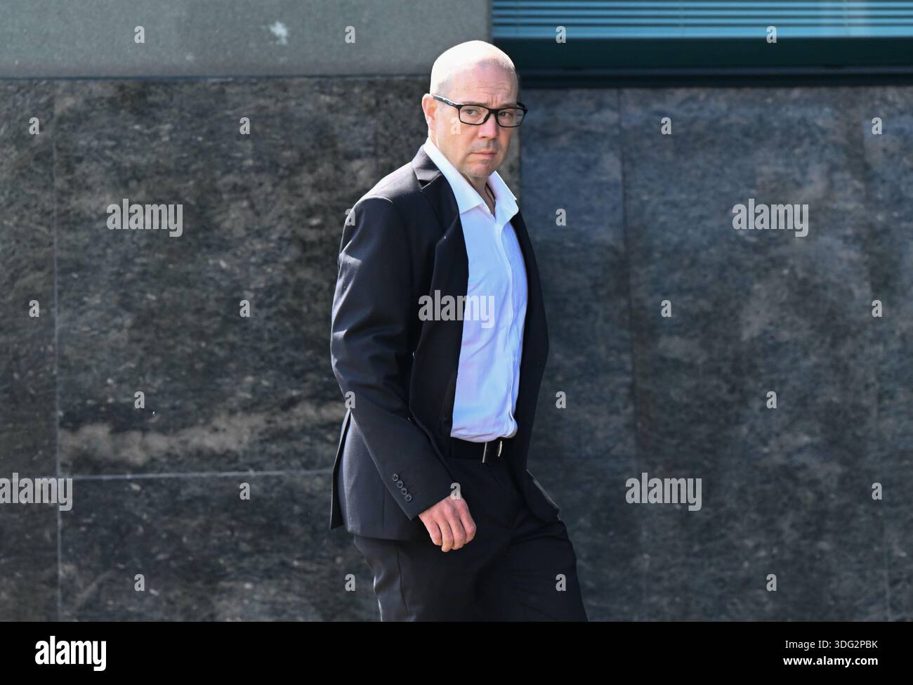 Neurosurgeon Richard William Laherty is seen arriving at the Brisbane ...