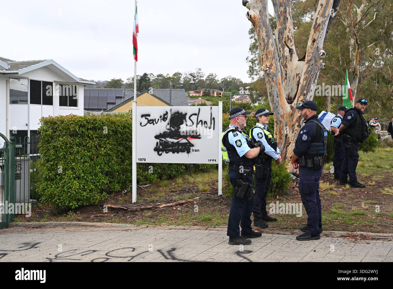 Police officers stand near the Iranian embassy during anti regime ...