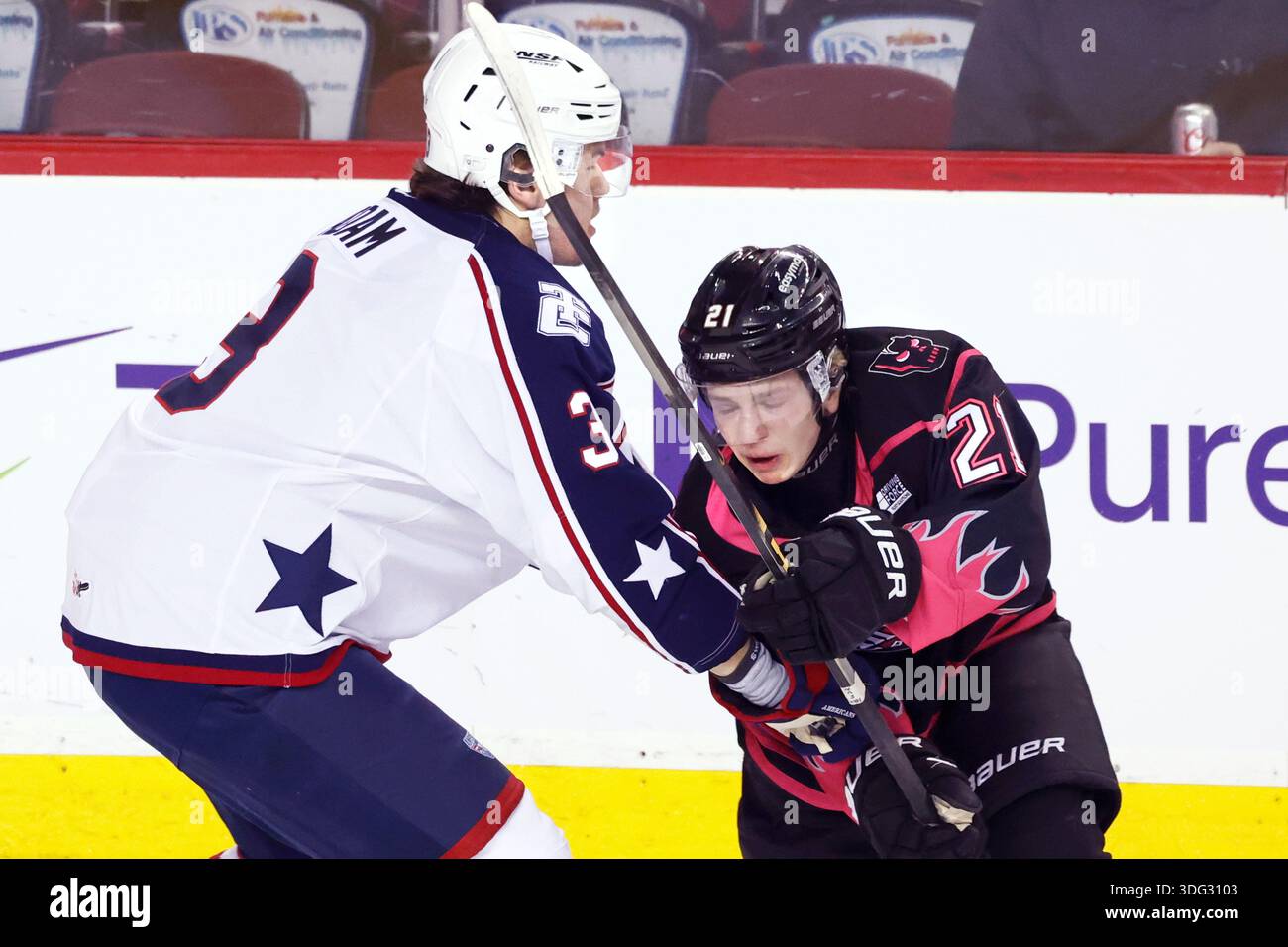 Tri-City Americans D Jaxen Adam, lt, runs into Calgary Hitmen LW Keaton ...