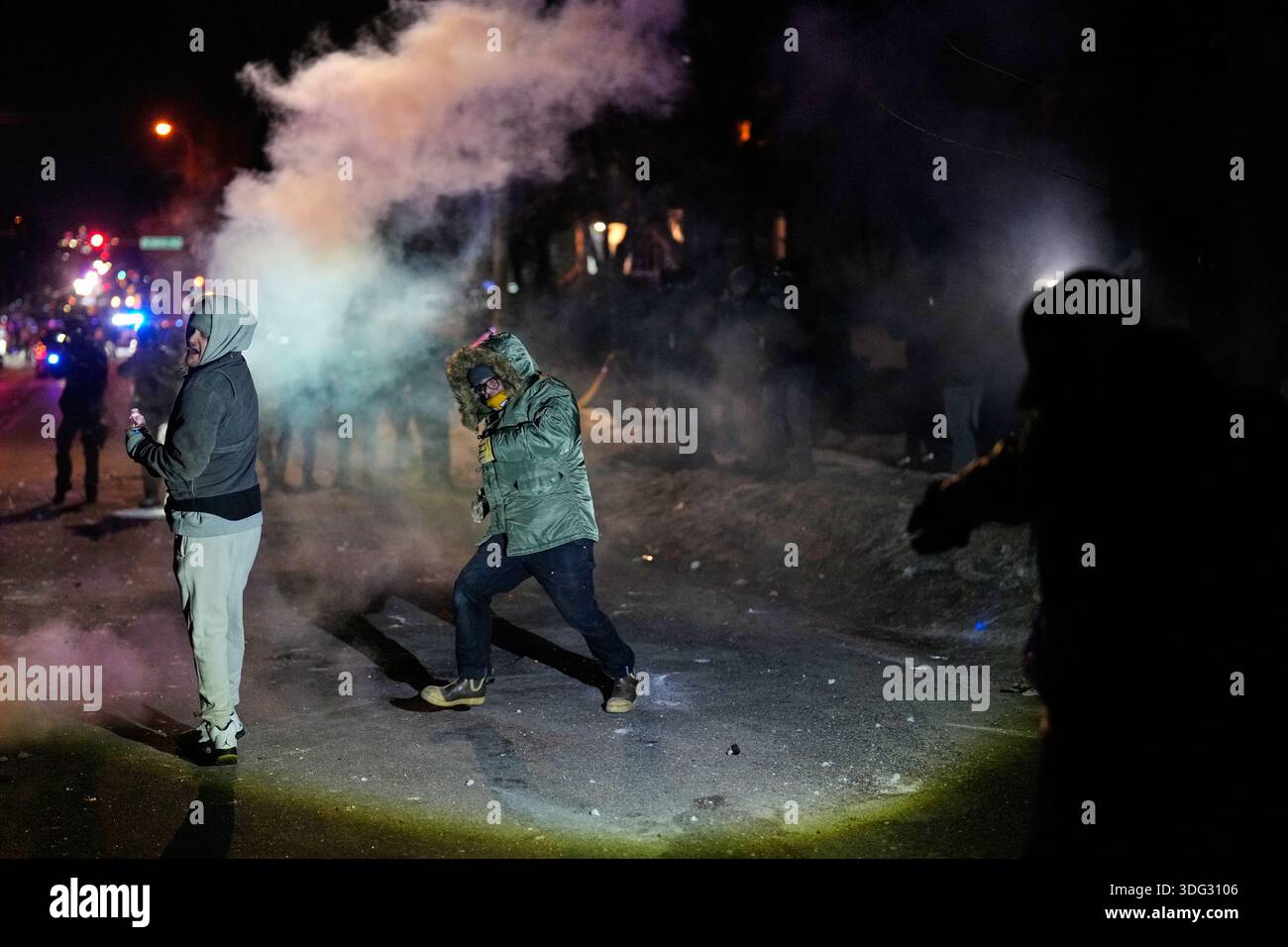 Protesters are hit with projectiles at the scene of a reported shooting ...