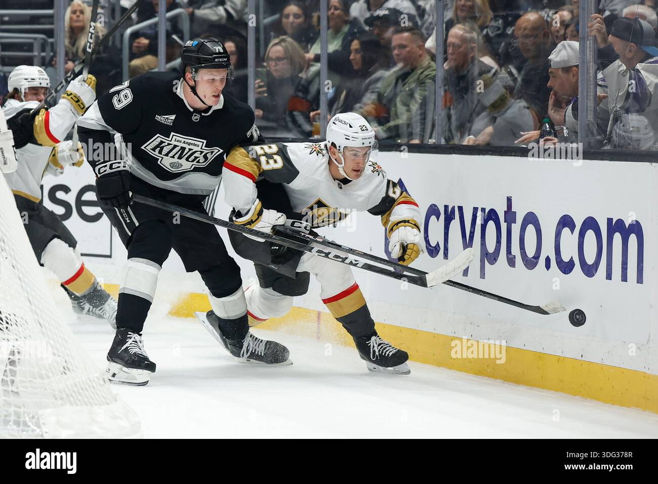Vegas Golden Knights left wing Cole Reinhardt (23) reaches for the puck ...