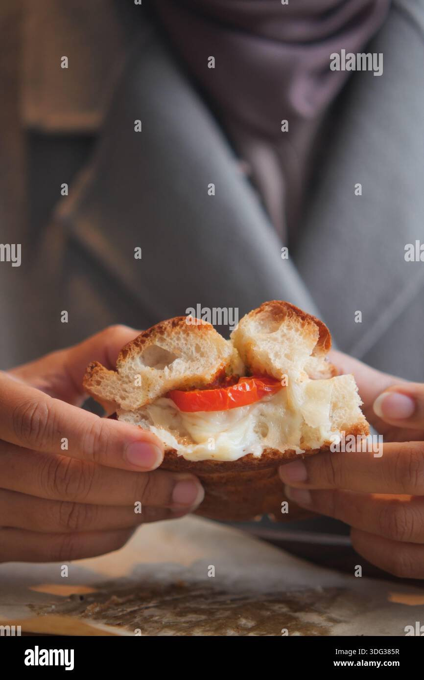 Person holds sandwich tomato hi-res stock photography and images - Alamy