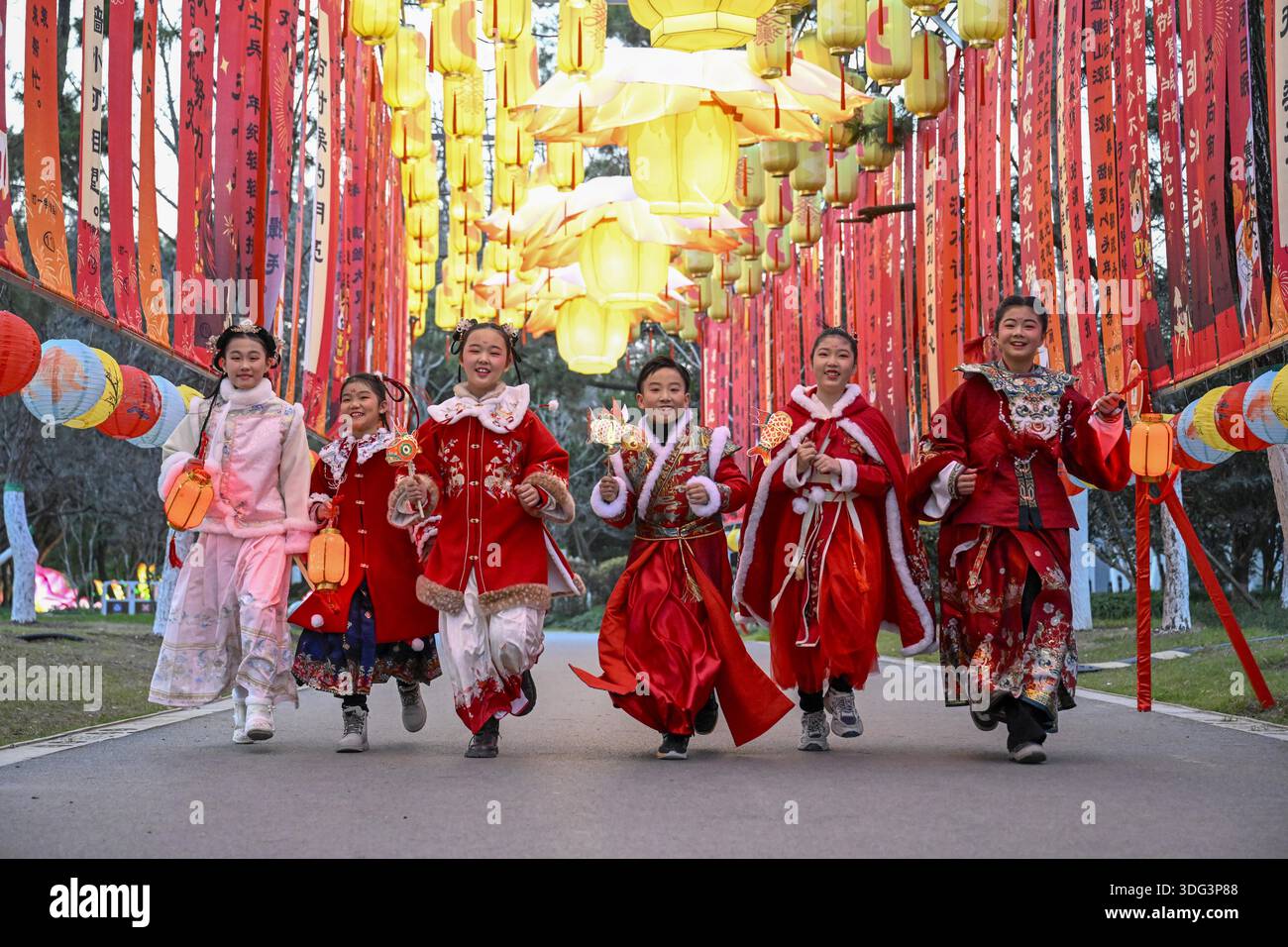 Pupils admire festive lanterns at Xiaoyaojin Park in Hefei City, east ...