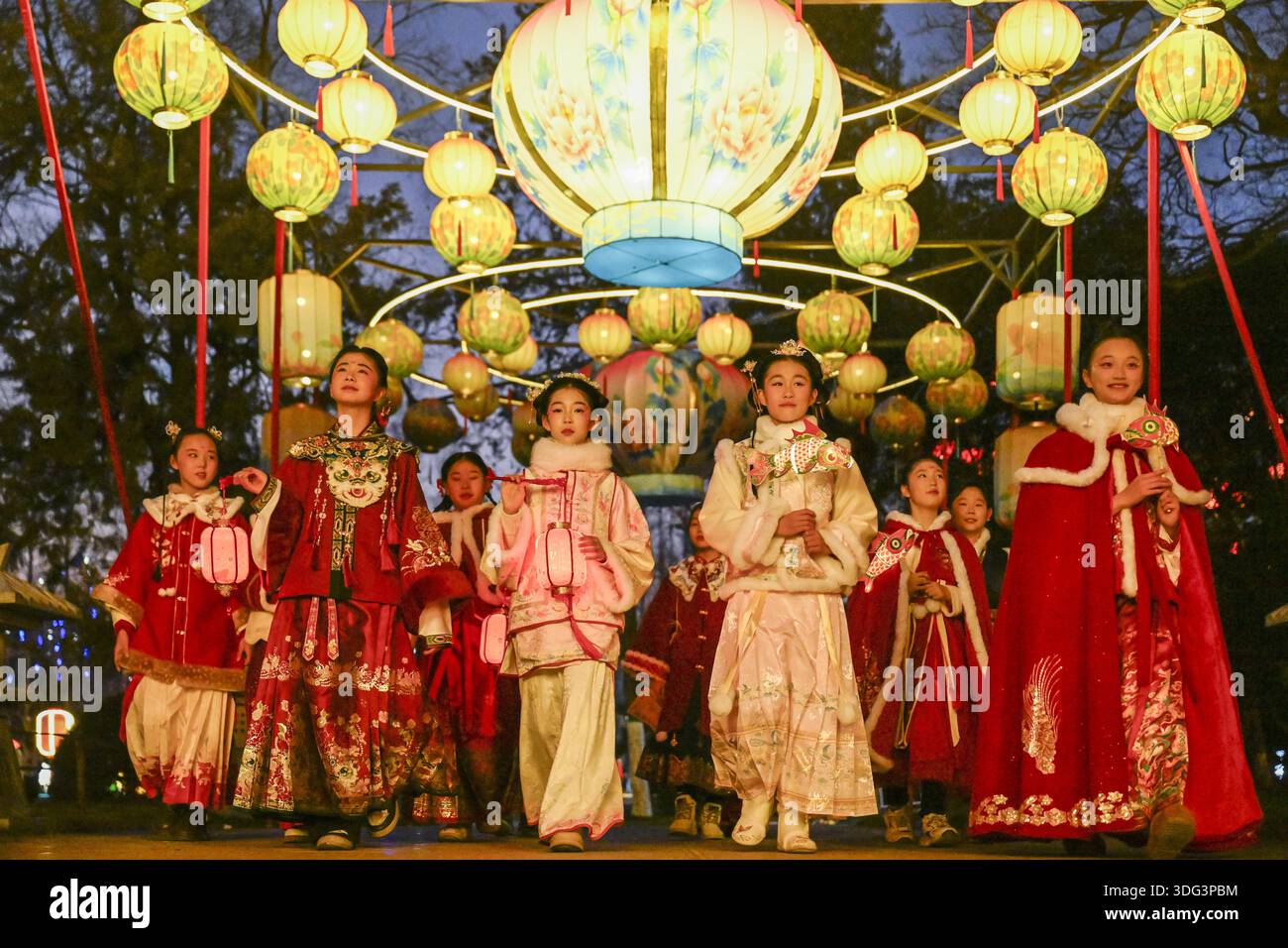 Pupils admire festive lanterns at Xiaoyaojin Park in Hefei City, east ...