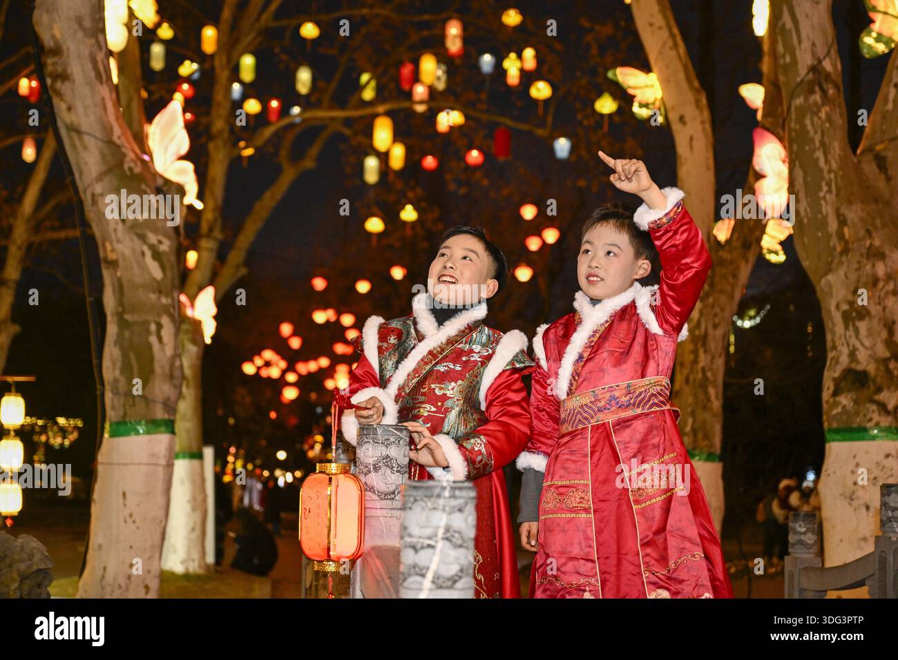 Pupils admire festive lanterns at Xiaoyaojin Park in Hefei City, east ...