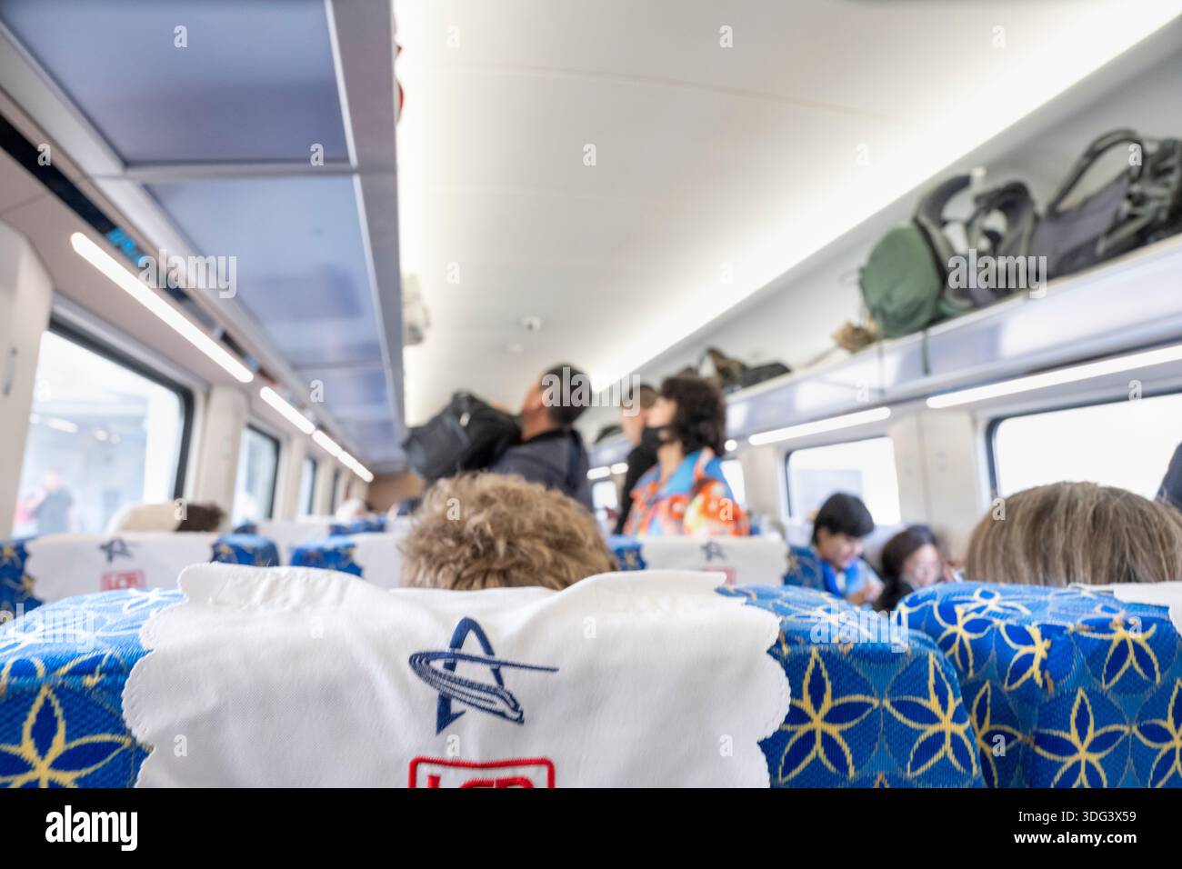 Laos-January 11 2026:Passengers aboard the high speed train sort their ...