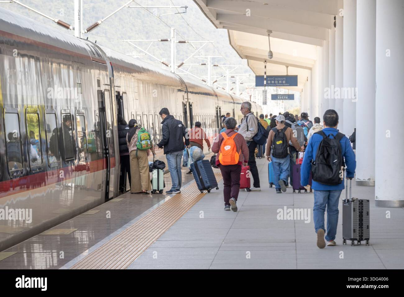 Laos-January 11 2026:People look for their carriages,as the high speed ...