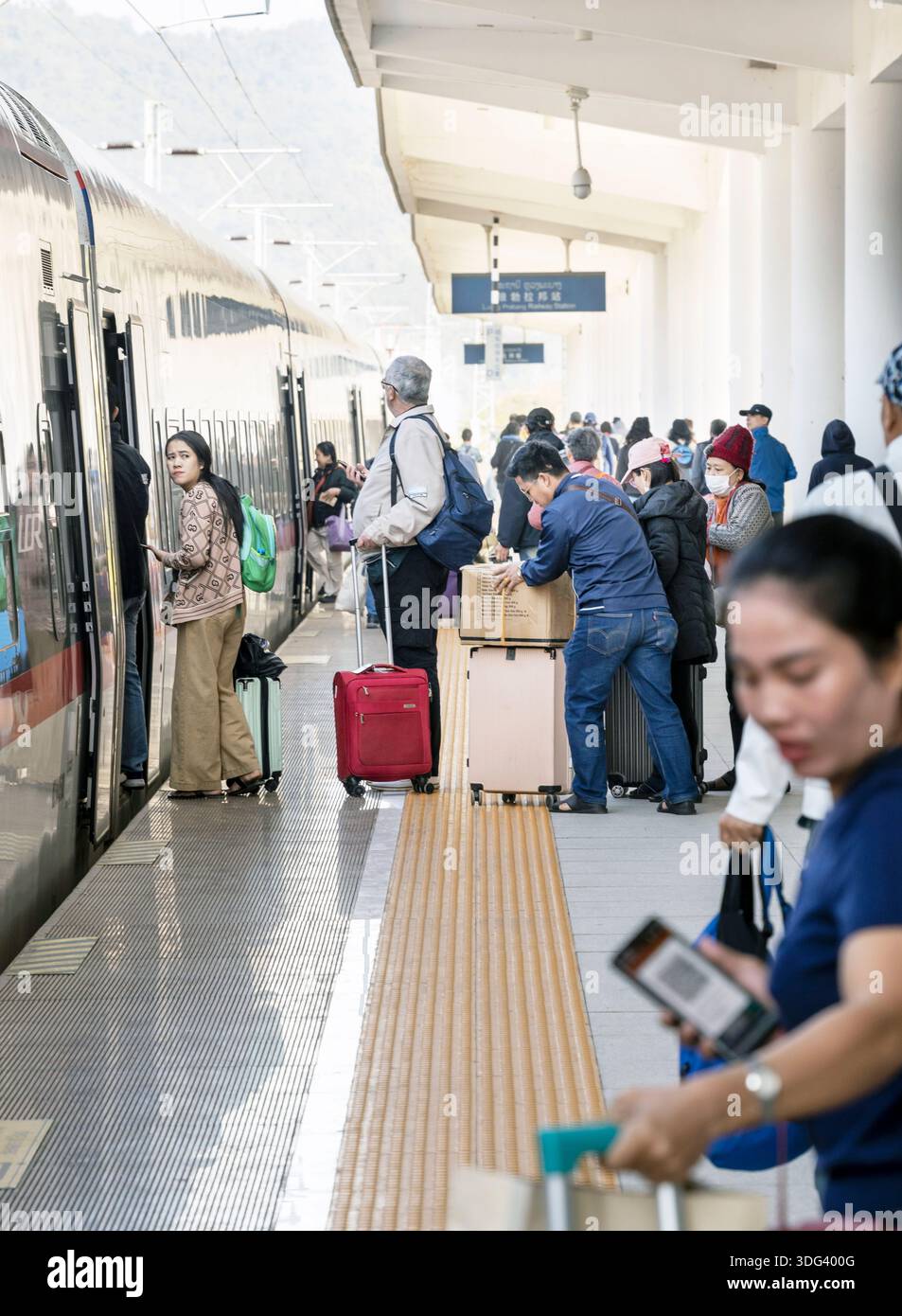 Laos-January 11 2026:People look for their carriages,as the high speed ...
