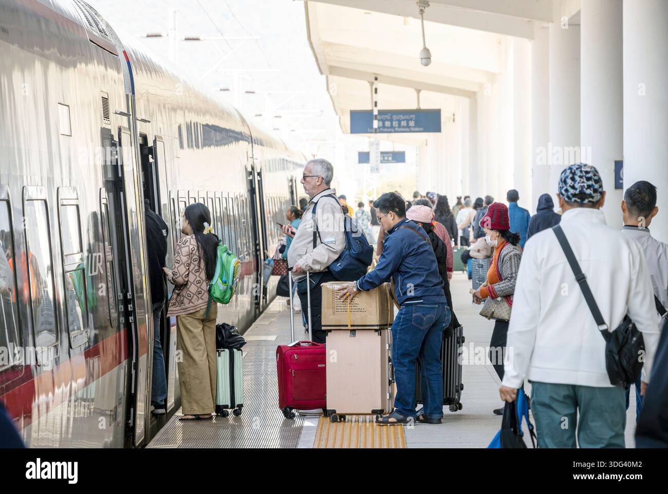 Laos-January 11 2026:People look for their carriages,as the high speed ...