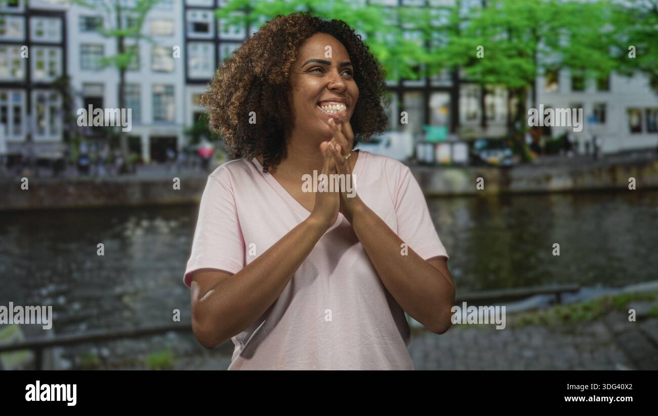 Woman raising hands amsterdam hi-res stock photography and images - Alamy