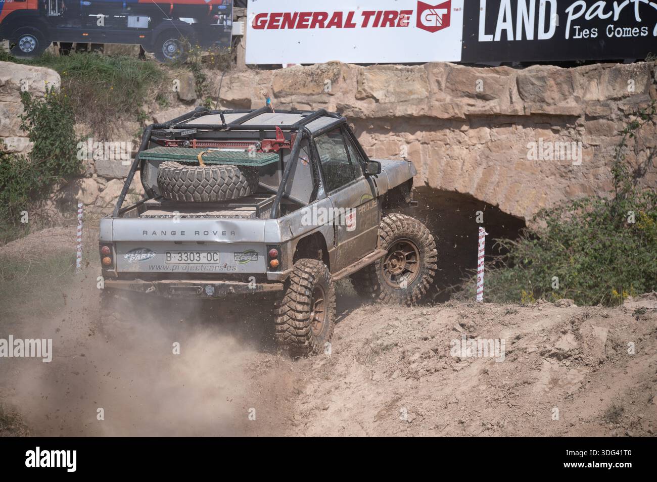 Rear view of a silver modified Range Rover Classic bobtail pickup ...