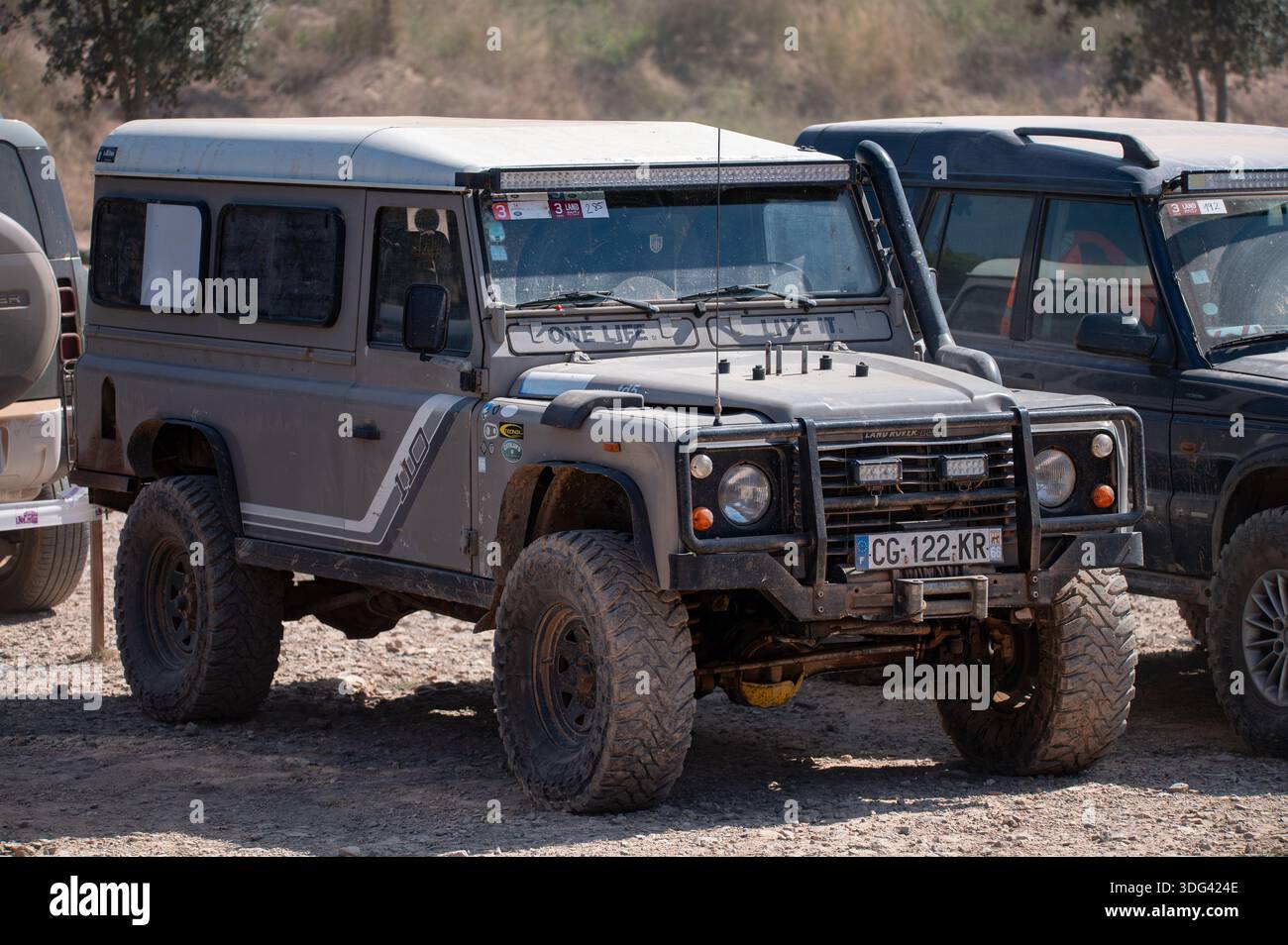 Front view of a grey Land Rover Defender 110 off-road 4x4. Features a ...