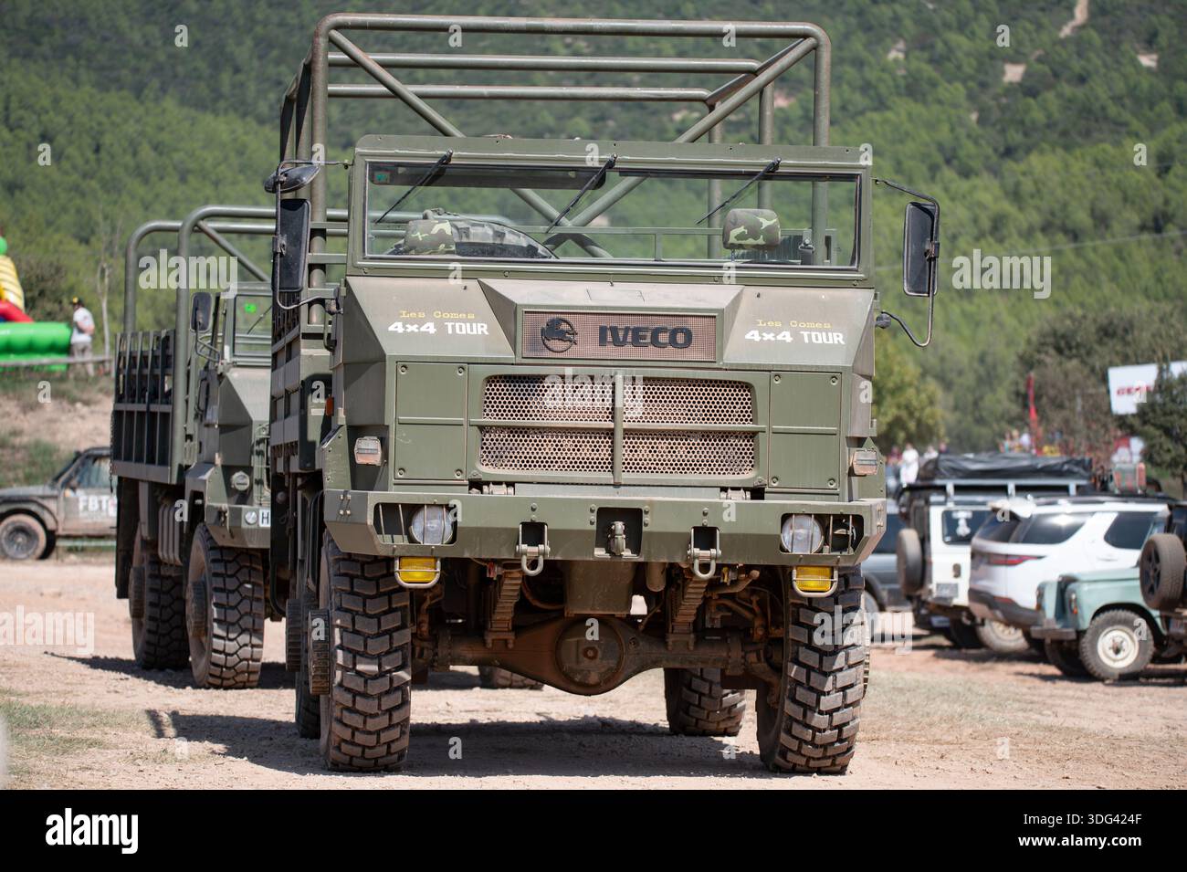 Front view of a convoy of olive green Pegaso Iveco 7217 military trucks ...