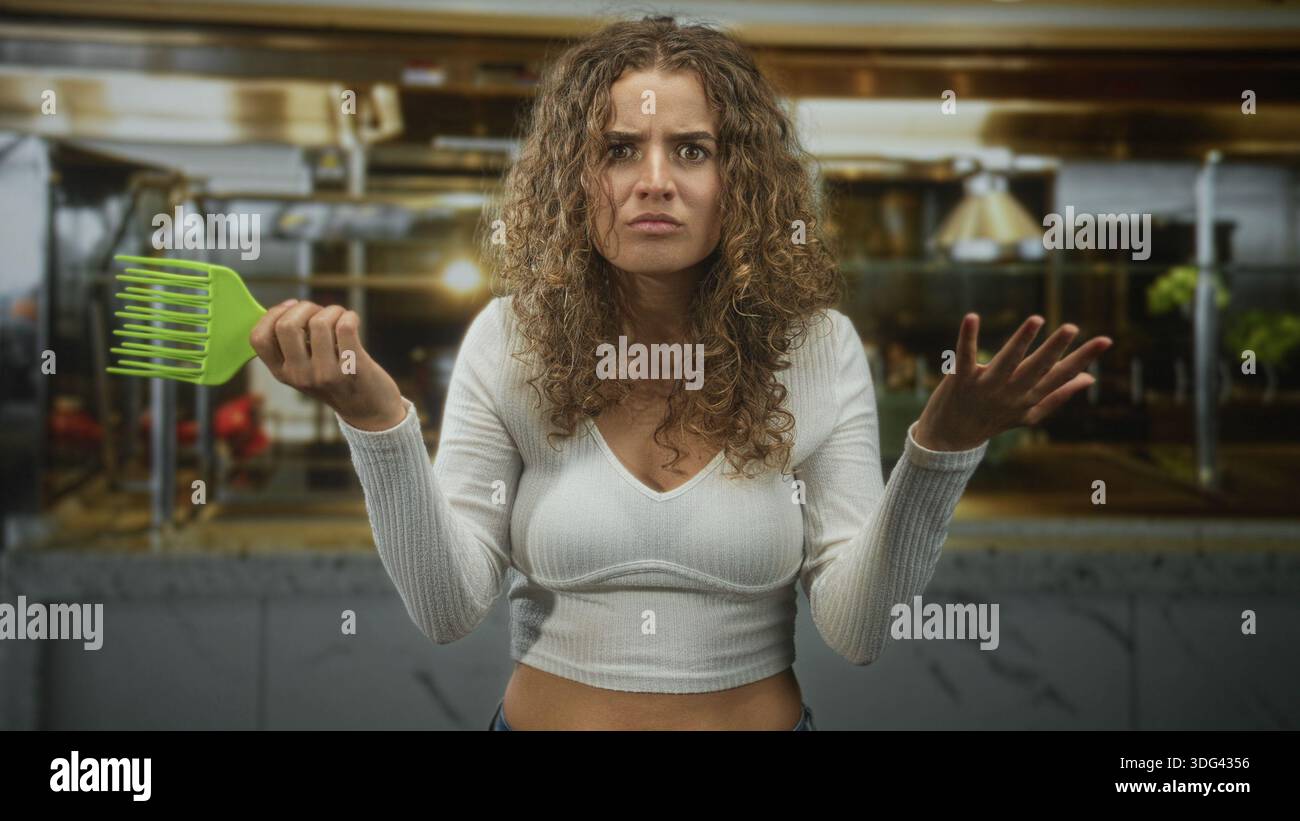 Young woman furrowed brow raised hi-res stock photography and images ...