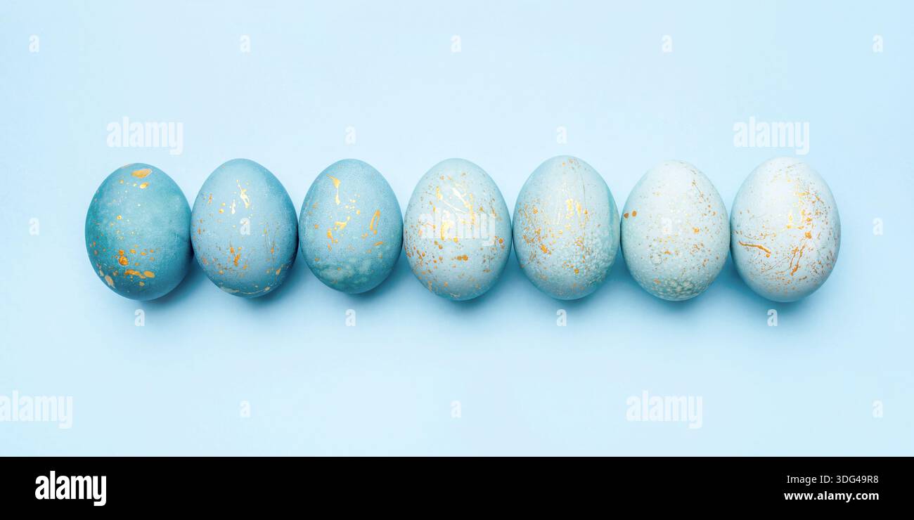 Easter background of eggs painted in blue color. Flat lay, top view ...