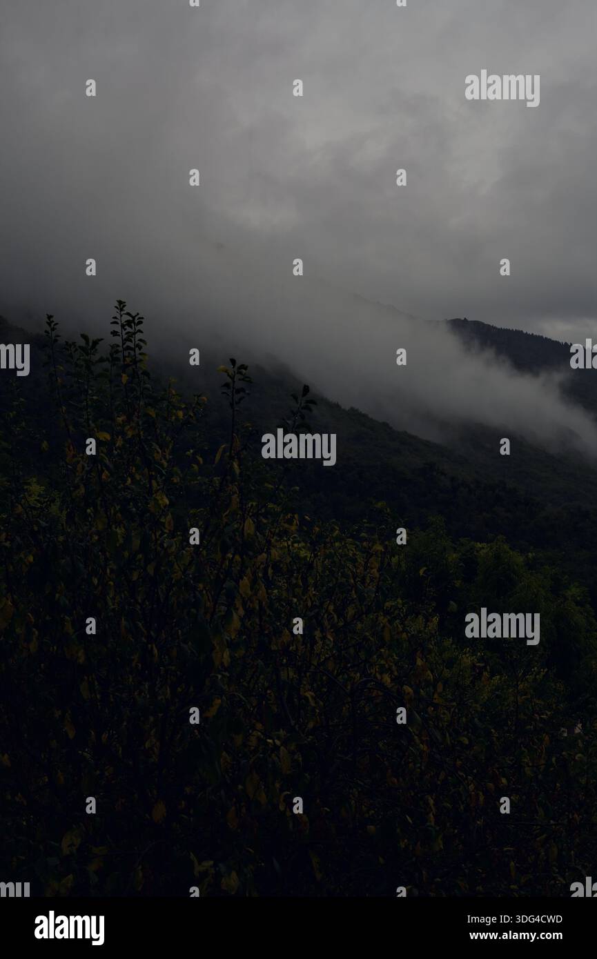 Mountain ridges with clouds passing over it during a rainfall Stock ...