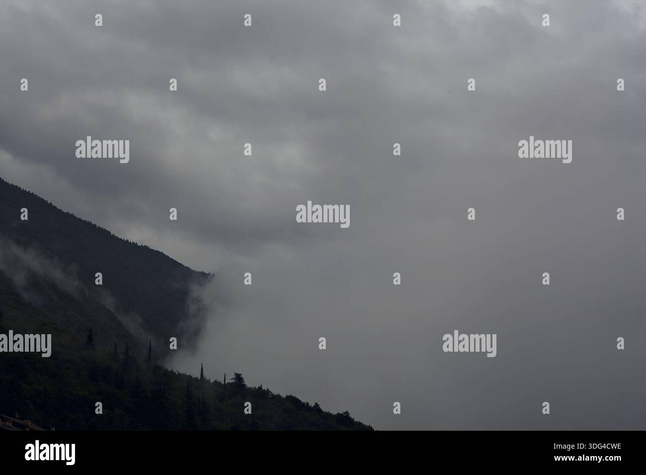 Mountain ridges with clouds passing over it during a rainfall Stock ...