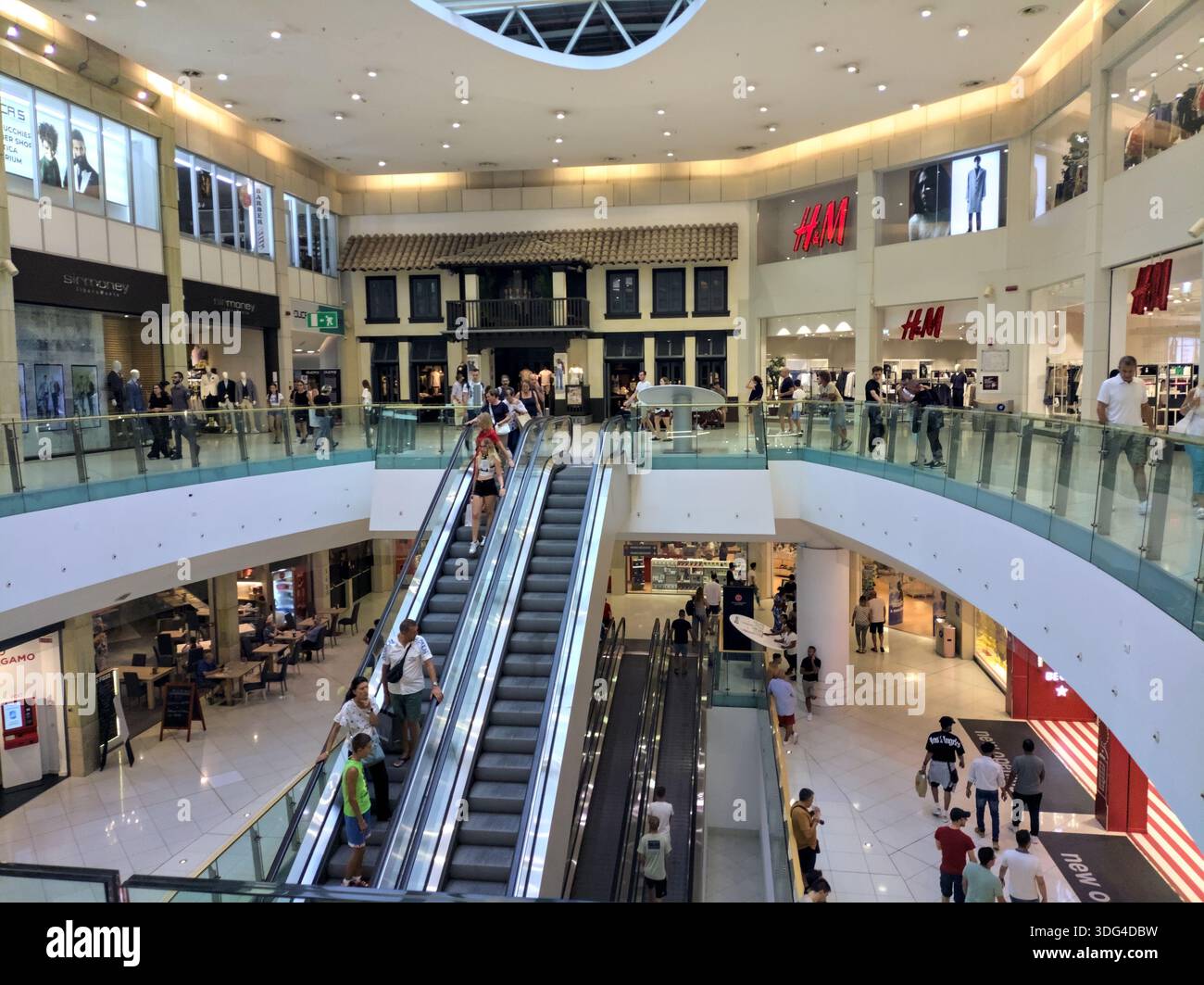 Bergamo, Italy - August 2024 - Halls with shops and people strolling ...