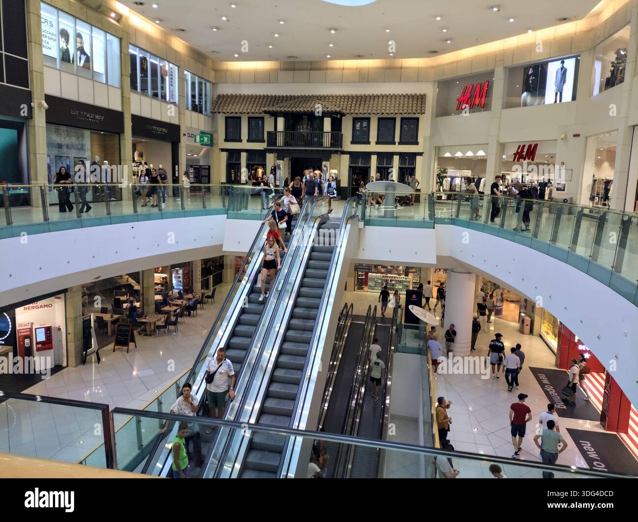 Bergamo, Italy - August 2024 - Halls with shops and people strolling ...