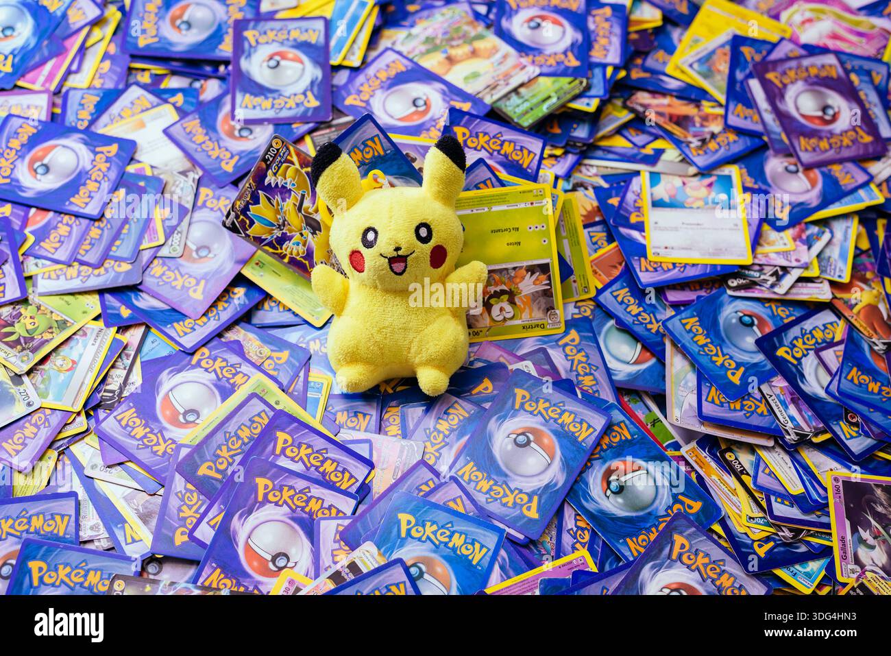 Valencia, Spain - December 10, 2025: Pokemon doll on a game cards with ...