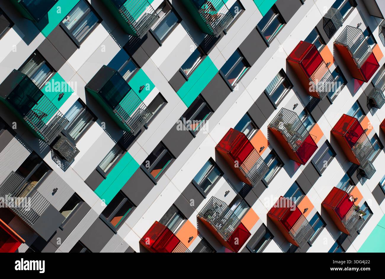 Diagonal view of a modern residential building facade with colorful ...