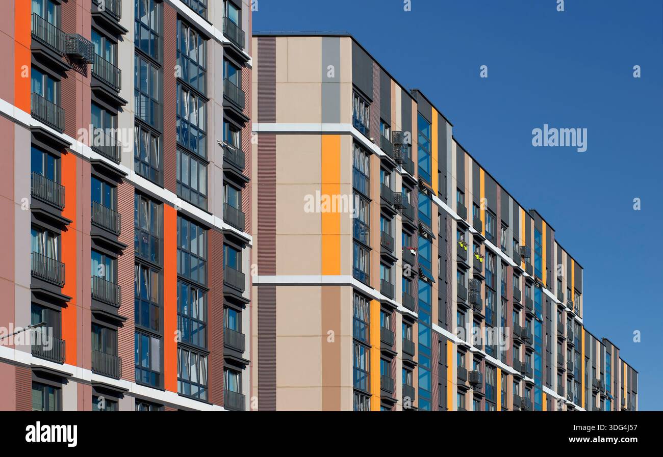 Modern residential building facade with colorful vertical panels in ...