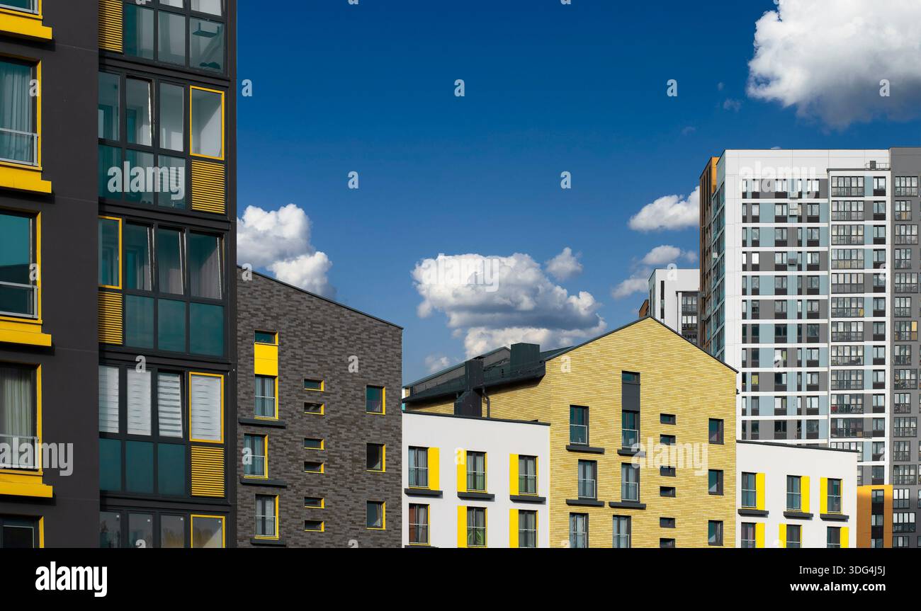 Modern residential buildings with colorful facades in shades of yellow ...