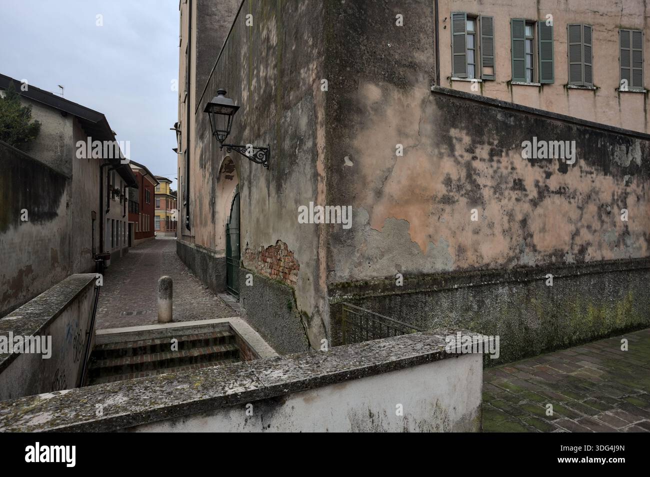 Staircase in a former fortification wall that leads to a cobbled alley ...