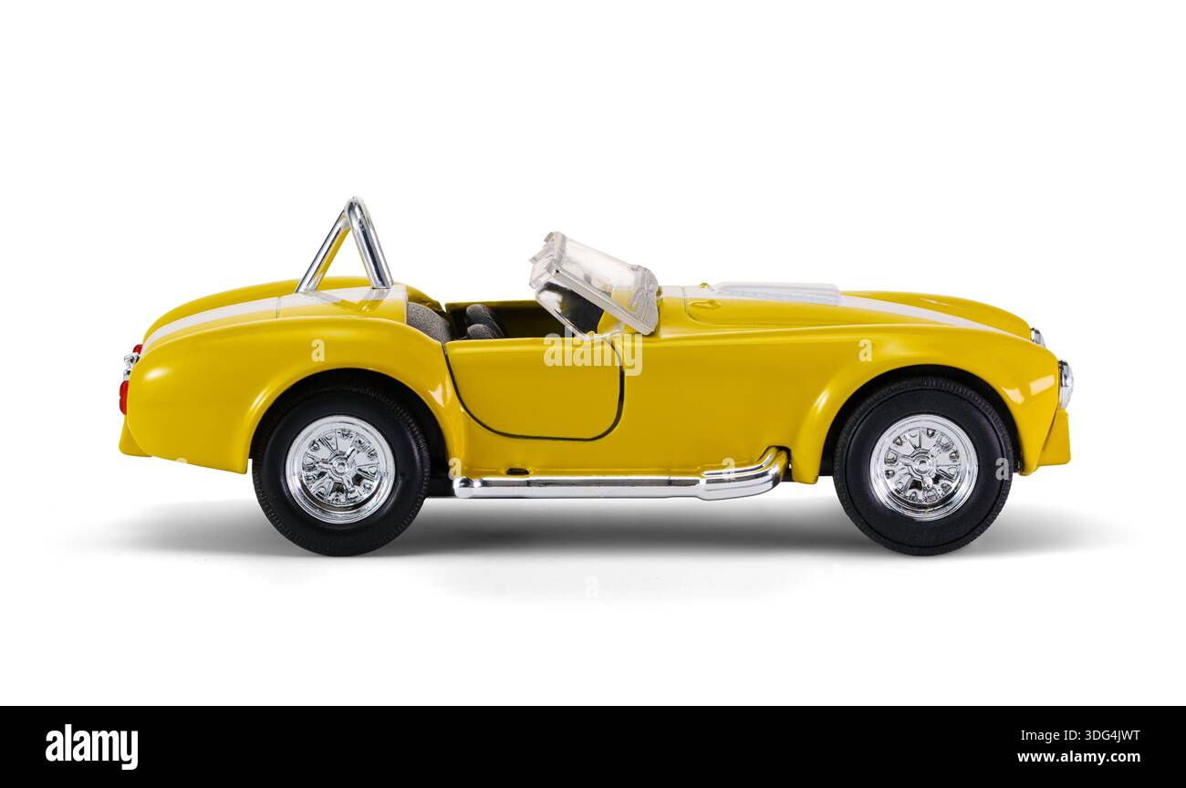 Model of yellow retro toy sport racing car on a white background ...