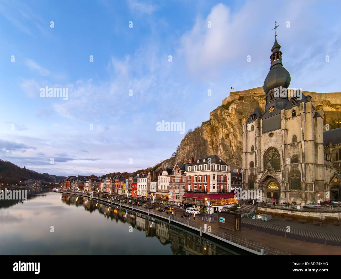 A festive panoramic view of Dinant showing the Collegiate Church and ...
