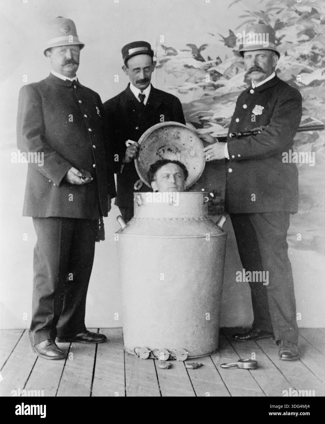 Two uniformed men holding Black and White Stock Photos & Images - Alamy
