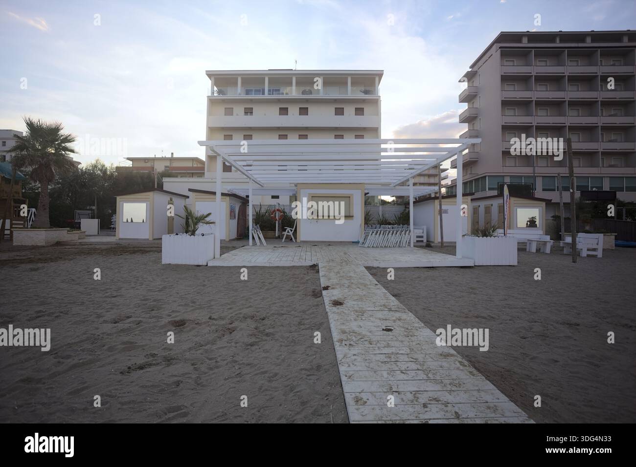 Empty and closed building of a beach resort at sunset Stock Photo - Alamy