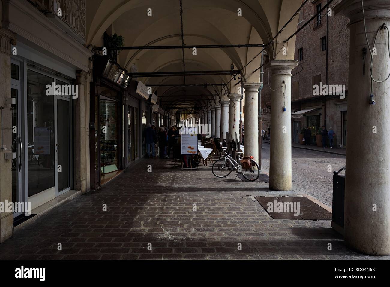Mantova, Italy - 22ND APRIL 2025 - Porch partially in the shade with ...